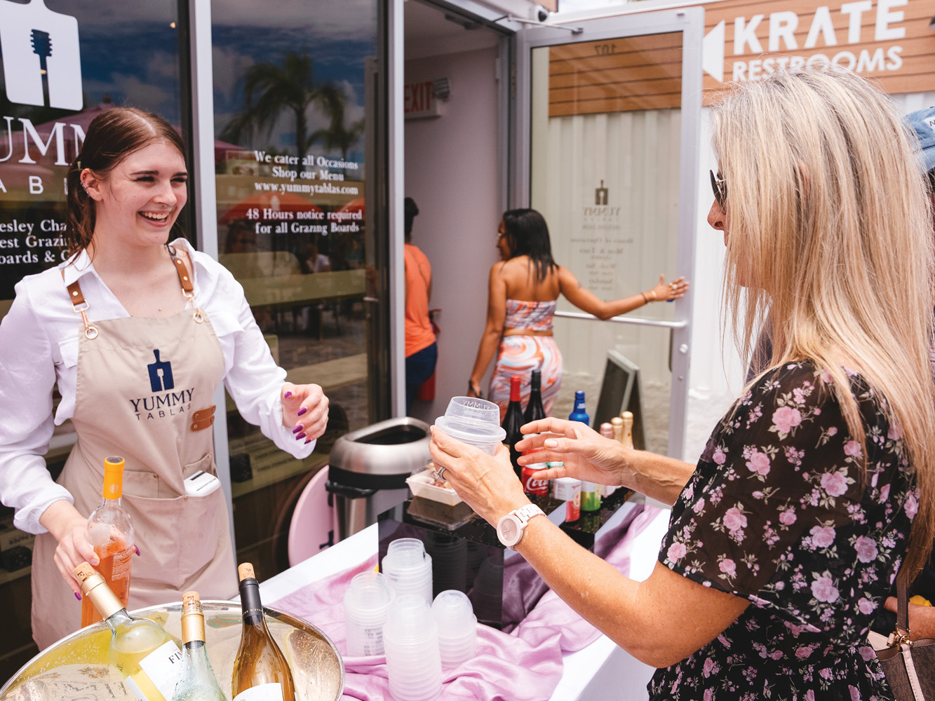 Handing-Out-Wine-Sample — Neighborhood News